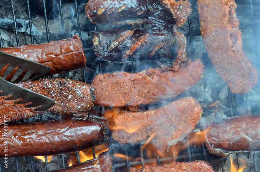 Sausage on a grill Stock Photo | Adobe Stock