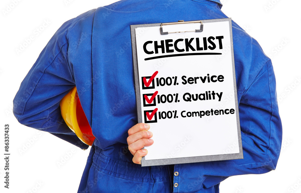 Worker with checklist for quality Stock Photo | Adobe Stock