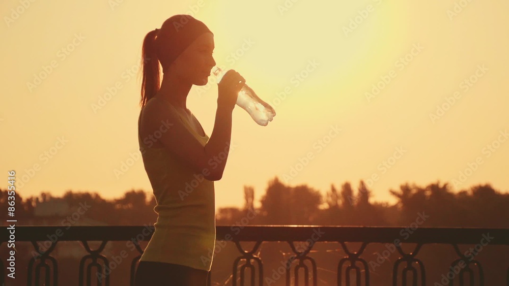 Slow motion: Running woman. Runner is jogging in sunny bright light ...