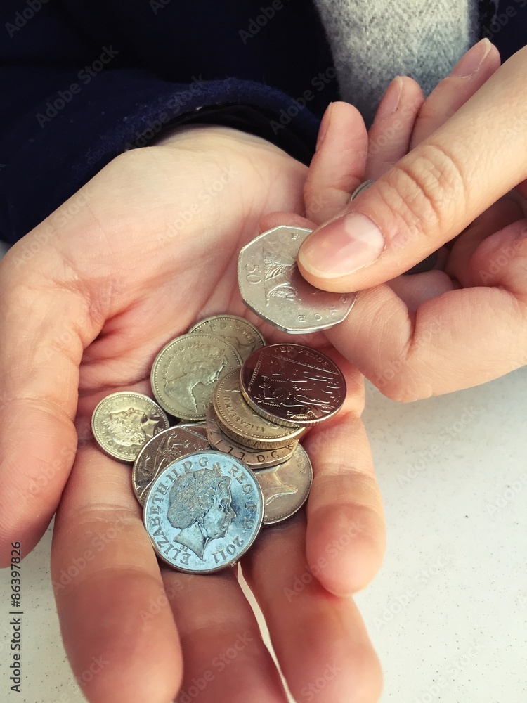Counting British Coins Stock Photo | Adobe Stock