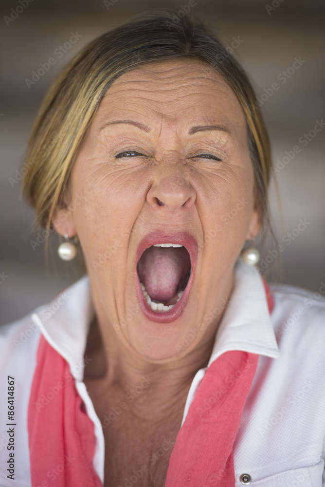 Tired yawning mature woman portrait Stock Photo | Adobe Stock