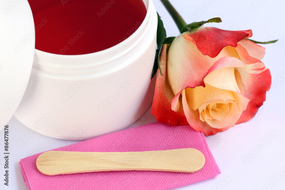 bodycare, depilation set: wax container, stick and rose Stock Photo ...