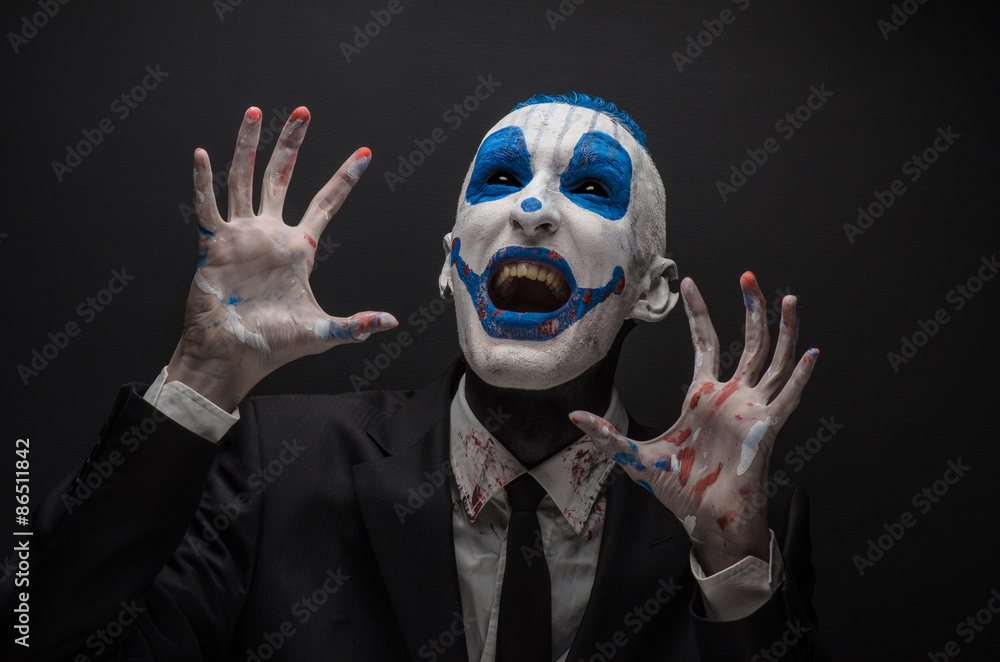Terrible clown and Halloween theme: Crazy blue clown in black suit ...