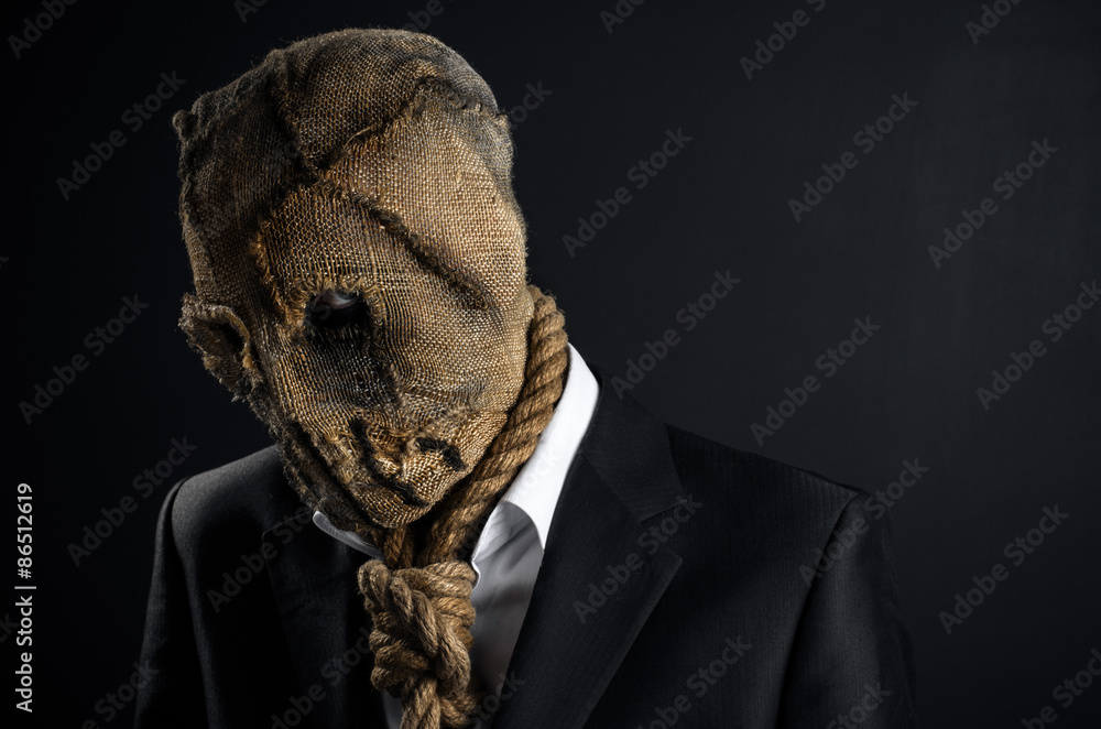 Fear and Halloween theme: a brutal killer in a mask on a dark ...