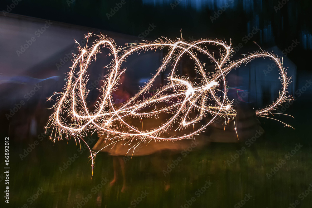Sparkler Firecracker Fourth of July Girl. Long exposure of a sparkler ...