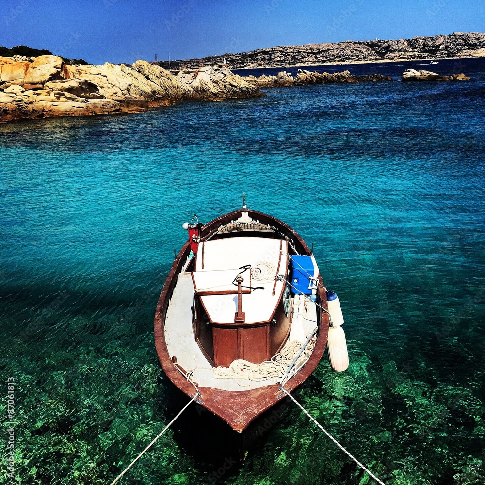 a boat and a beautiful beach Stock Photo | Adobe Stock