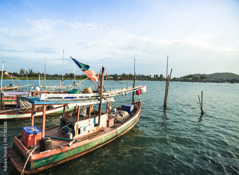 Small fishing boats dock at the shore Stock Photo | Adobe Stock