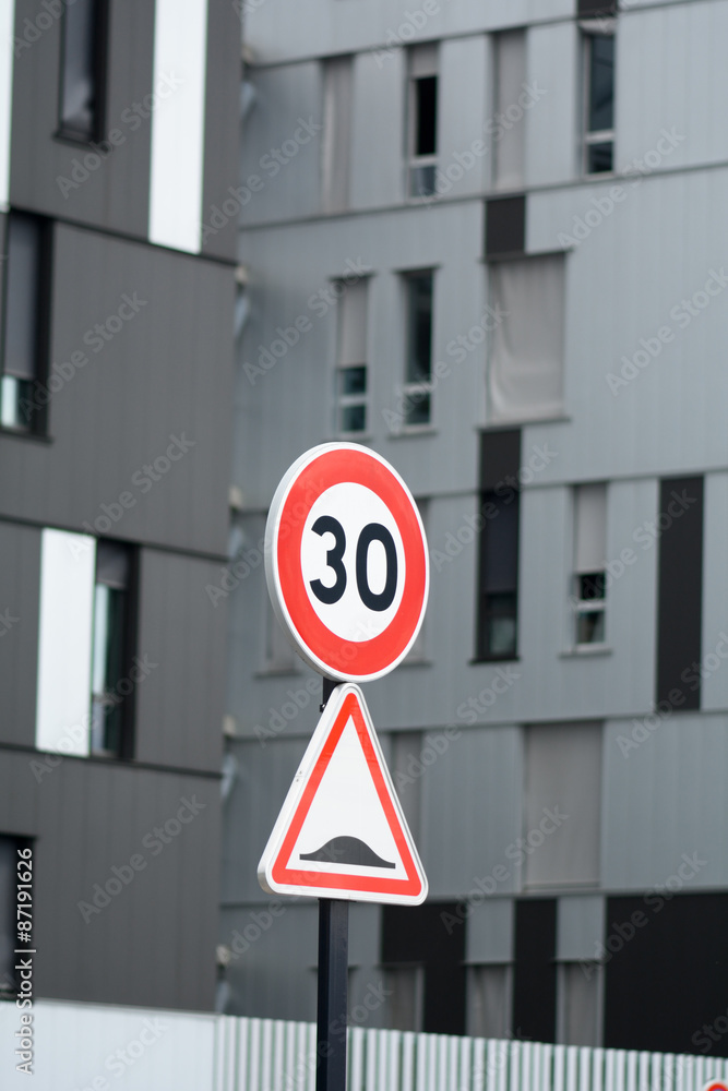 30 kph and speed bump road traffic signs in France Stock Photo | Adobe ...