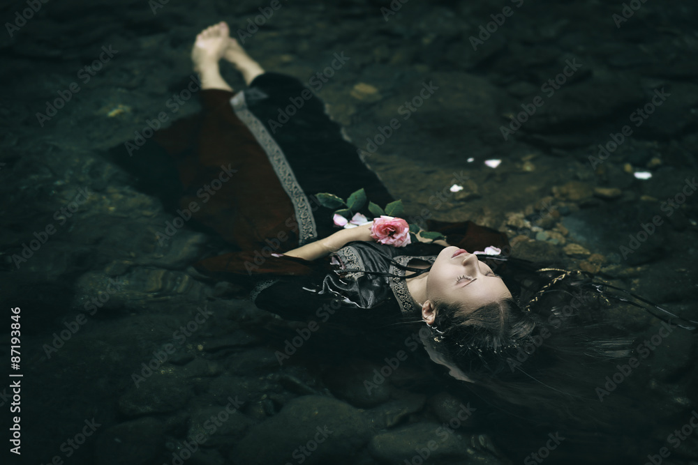 Beautiful floating dead woman in water Stock Photo | Adobe Stock