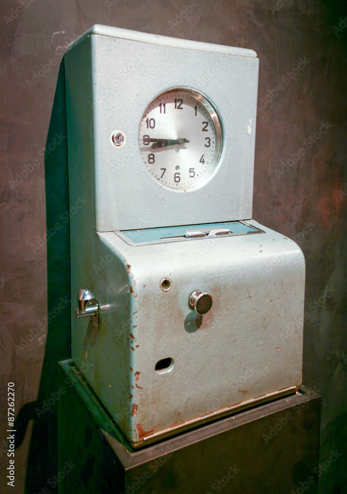 Time Clock. An old time clock for employees to keep track of their ...