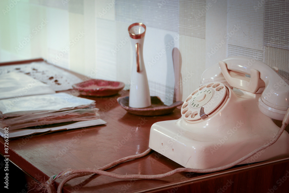 Retro desk. An retro scene of an old 1950's telephone in a contemporary ...