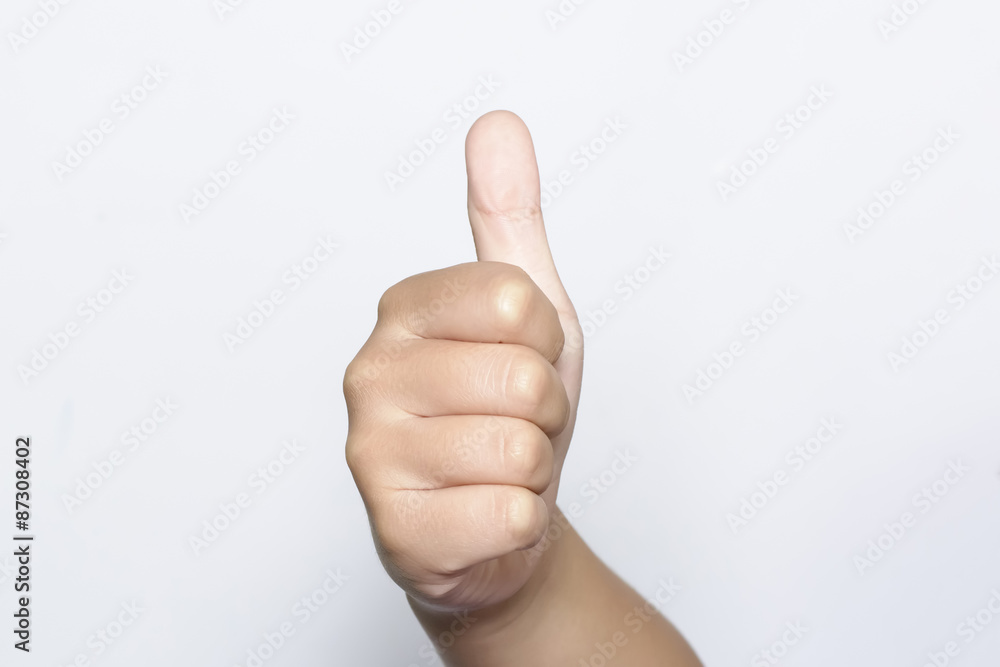 Boy raising one fingers up on hand that is thumb up its shows superb or ...