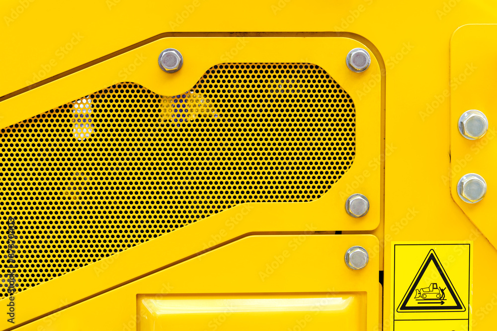 Surface of powerful bulldozer bodywork, engine compartment of ...