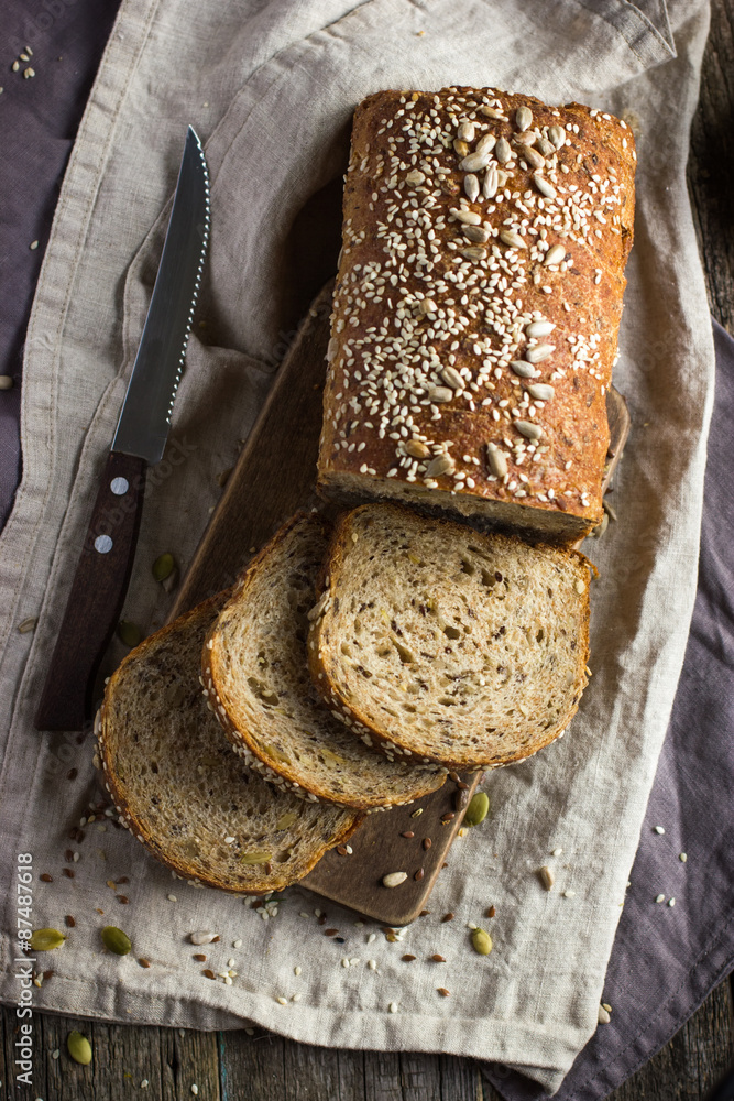 fresh multigrain bread on rustic background Stock Photo | Adobe Stock