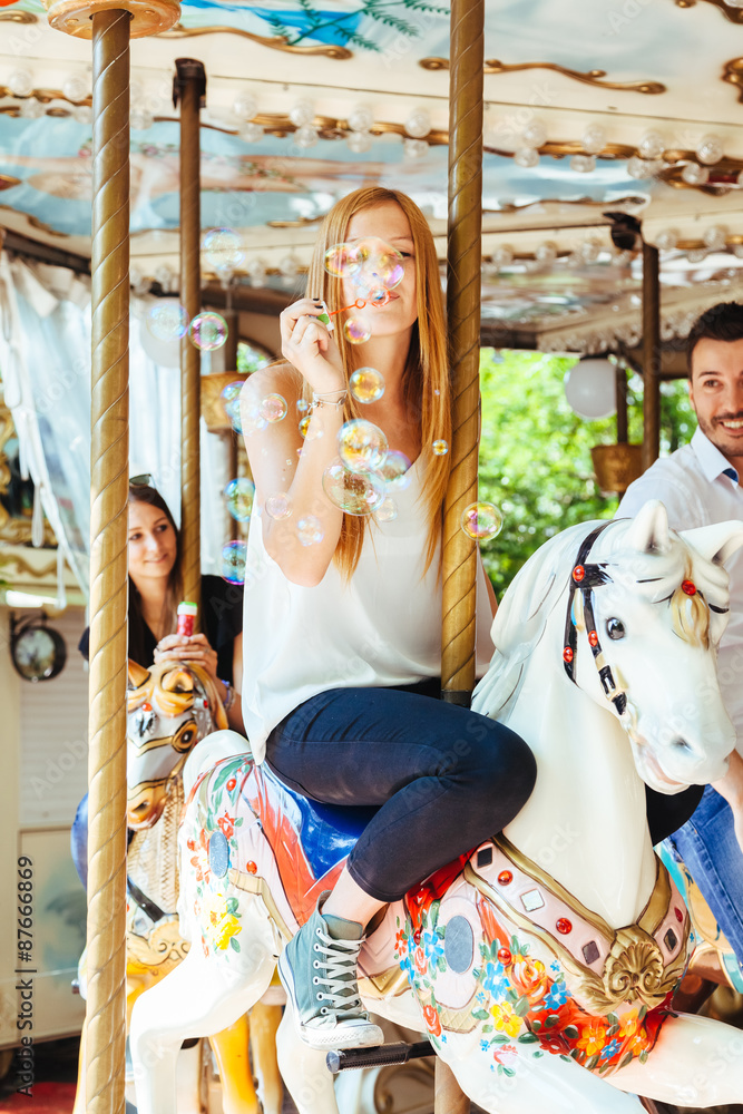 On a summer day a group of friends having fun in the shade on a ...