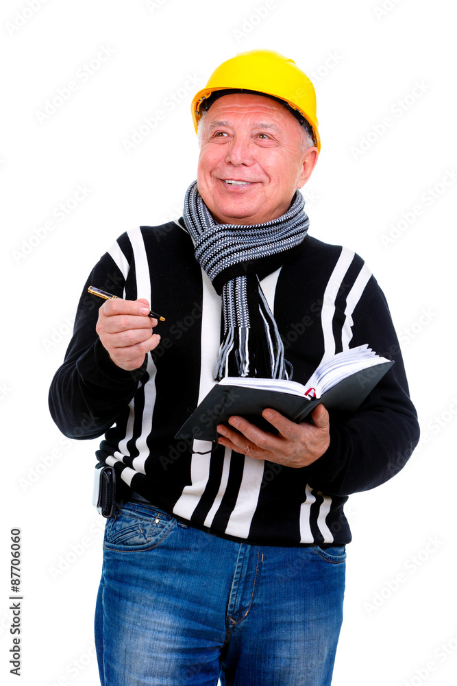 Smiling old man construction worker with helmet is checking the ...