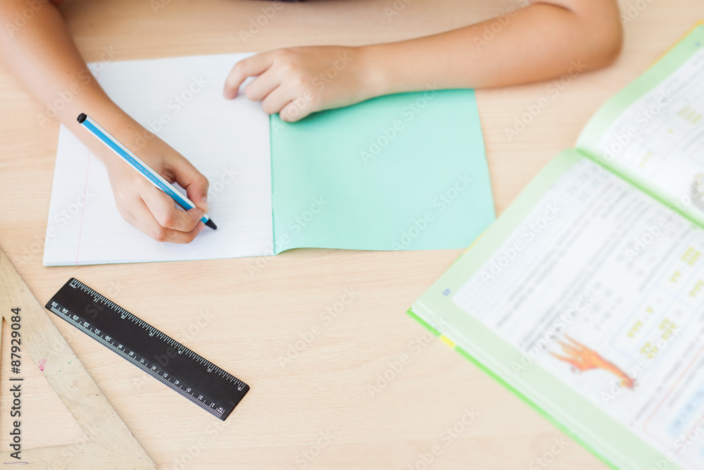 Desktop background of student sitting at desk for classwork Stock Photo ...