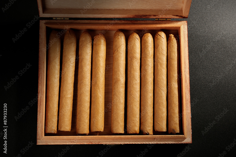 Collection of cigars in humidor on black table, top view Stock Photo ...