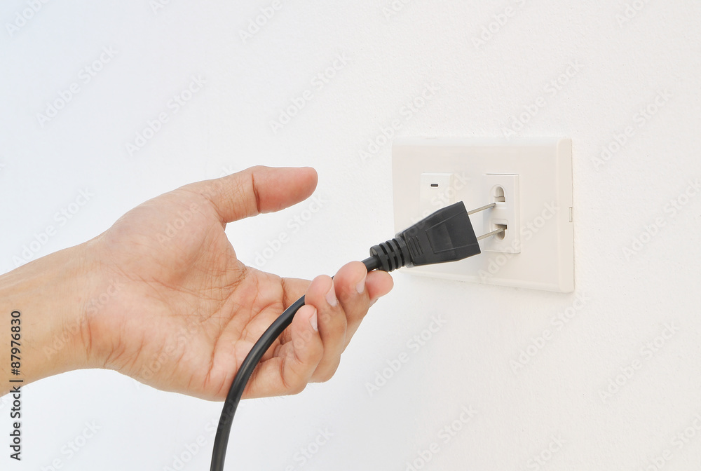 Hand unplug , electric shock Stock Photo | Adobe Stock