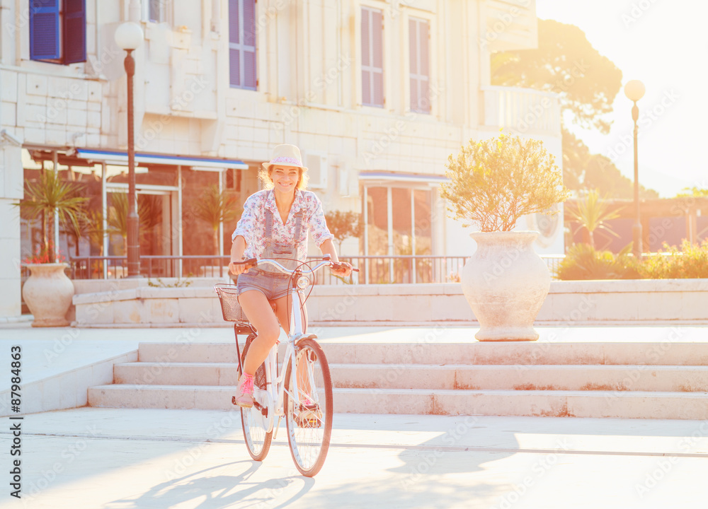 Beautiful happy woman riding on bike Stock Photo | Adobe Stock