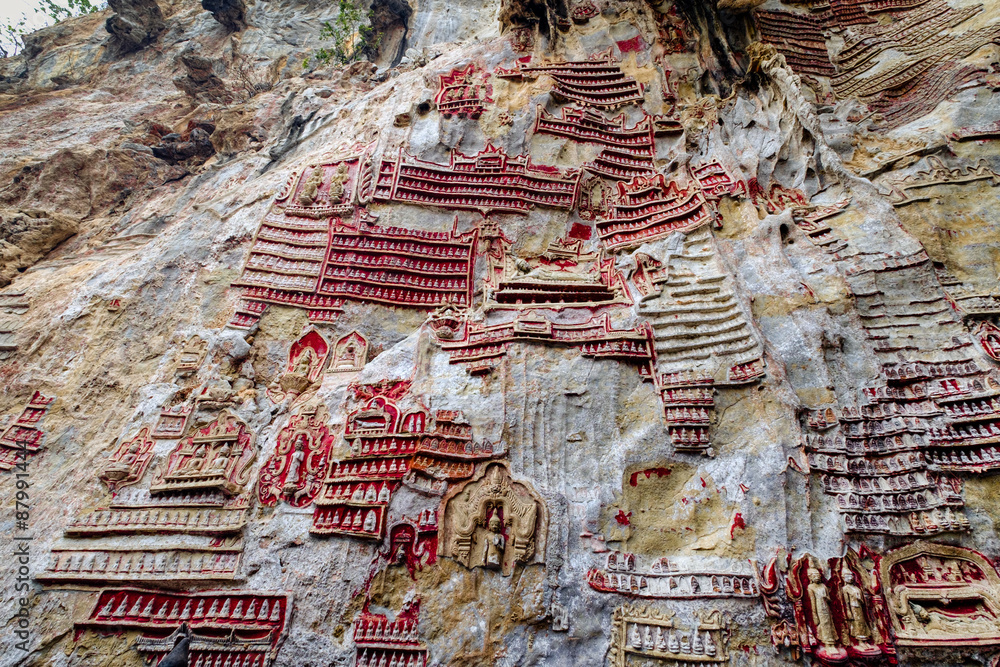 Kaw Goon Cave / Hundreds of rock carvings of Buddha Image on limestone ...