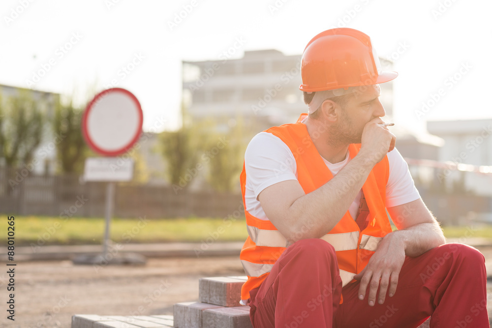 Smoking cigarette on construction site Stock Photo | Adobe Stock