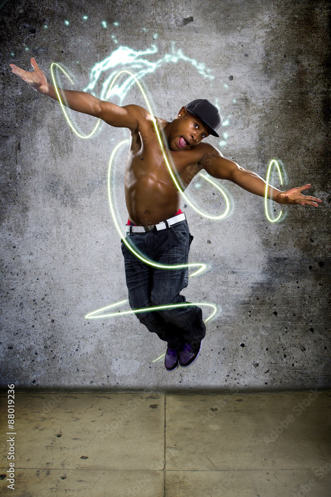 Jumping muscle man stylized with lights and graphics to show energy ...