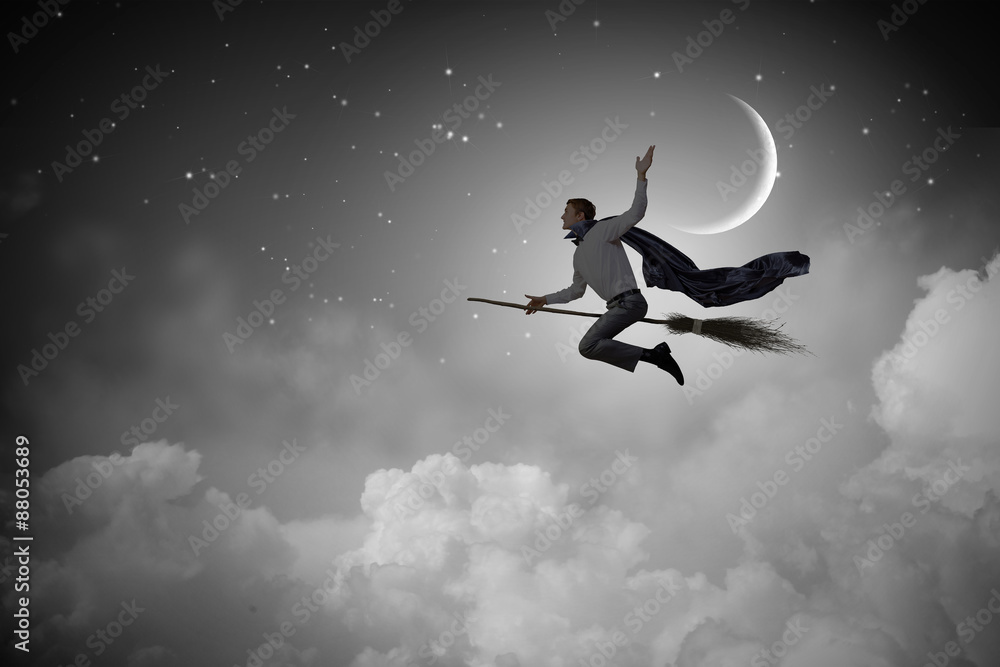 Man ride broom Stock Photo | Adobe Stock