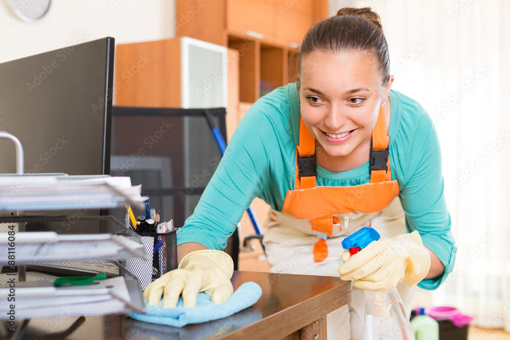 Woman cleaning at the office Stock Photo | Adobe Stock