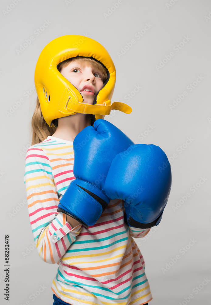 Beautiful young little girl wearing a pair of boxing gloves Stock Photo ...