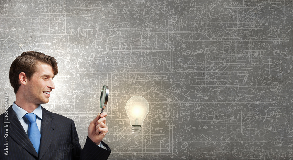 Man with magnifier Stock Photo | Adobe Stock