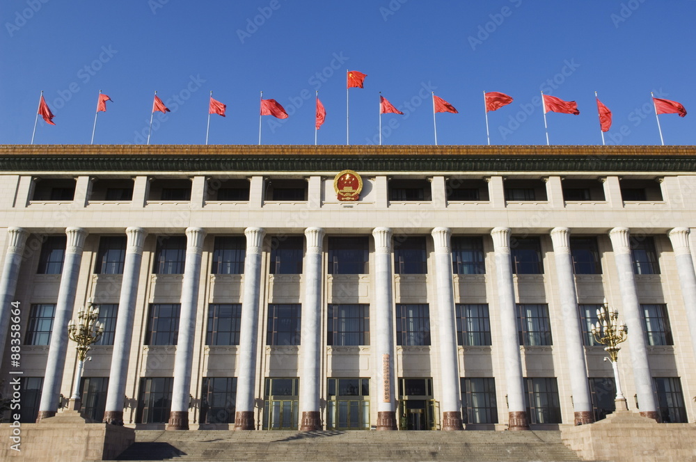 Chinese national flags on a government building Tiananmen Square ...