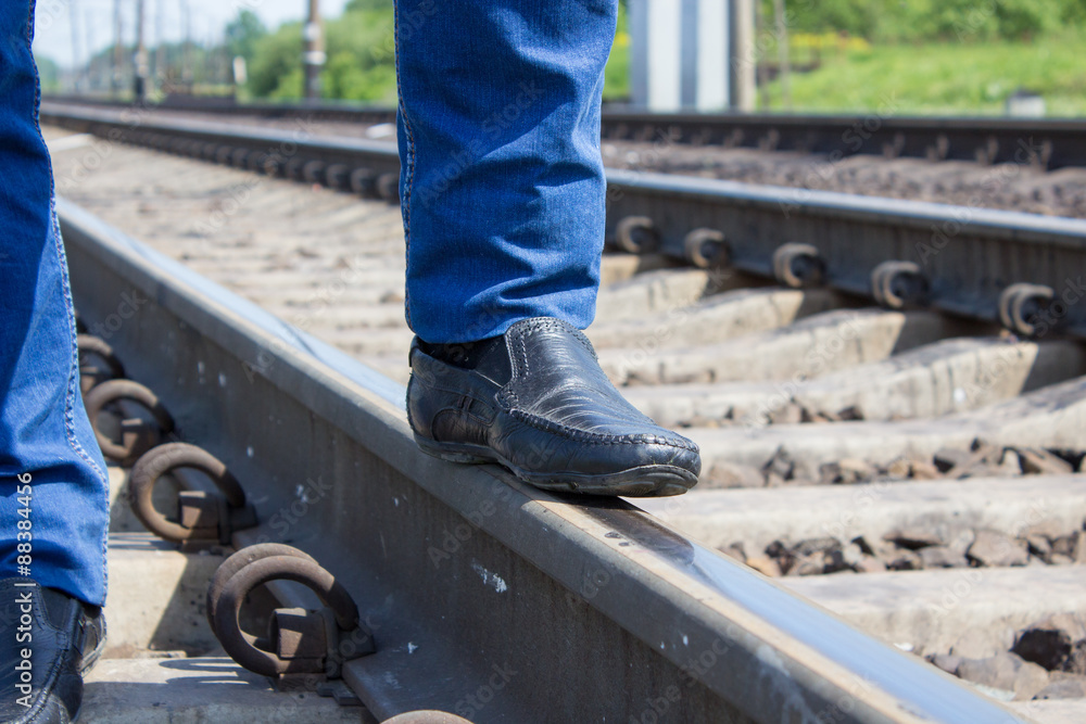 stand on railway track/dangerous to stand on railway tracks man in the ...