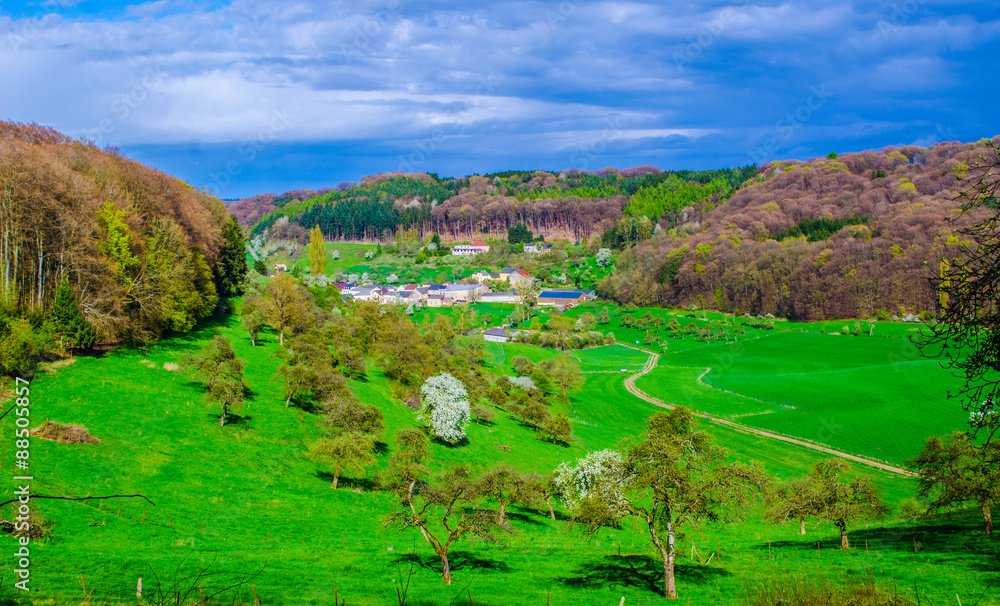 Typical countryside in luxembourg with small villages, forests, meadows ...