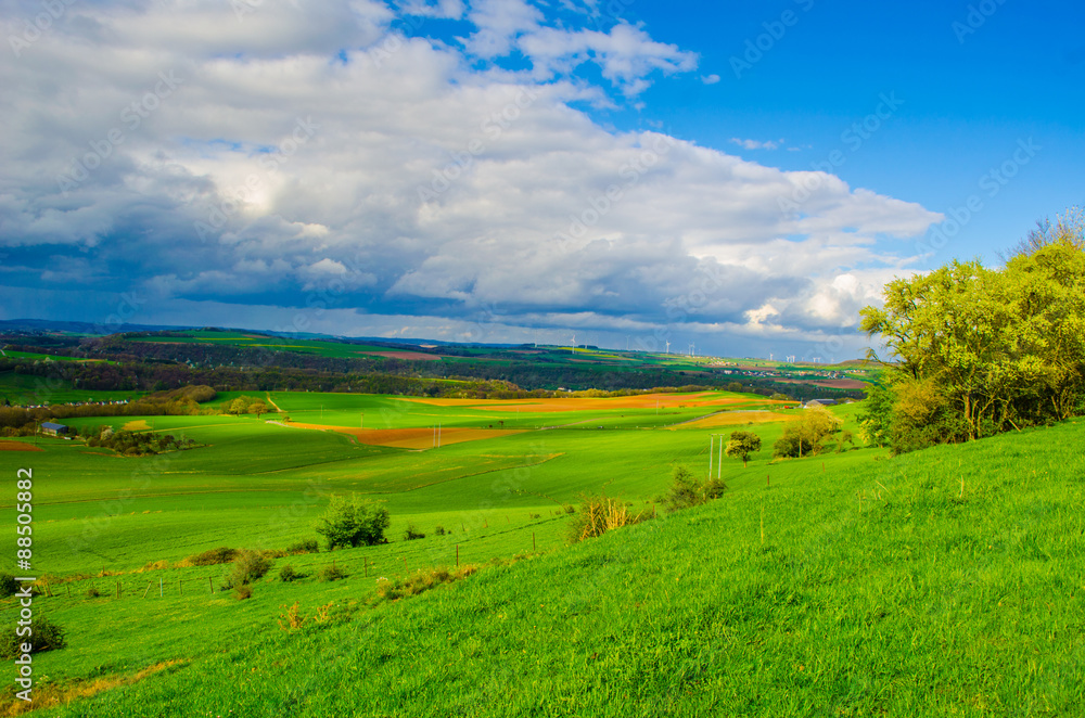 Typical countryside in luxembourg with small villages, forests, meadows ...
