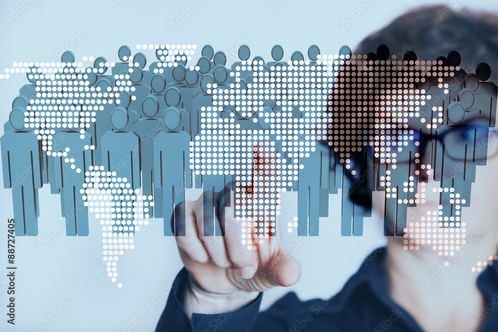 Woman pointing at world map with people Stock Photo | Adobe Stock