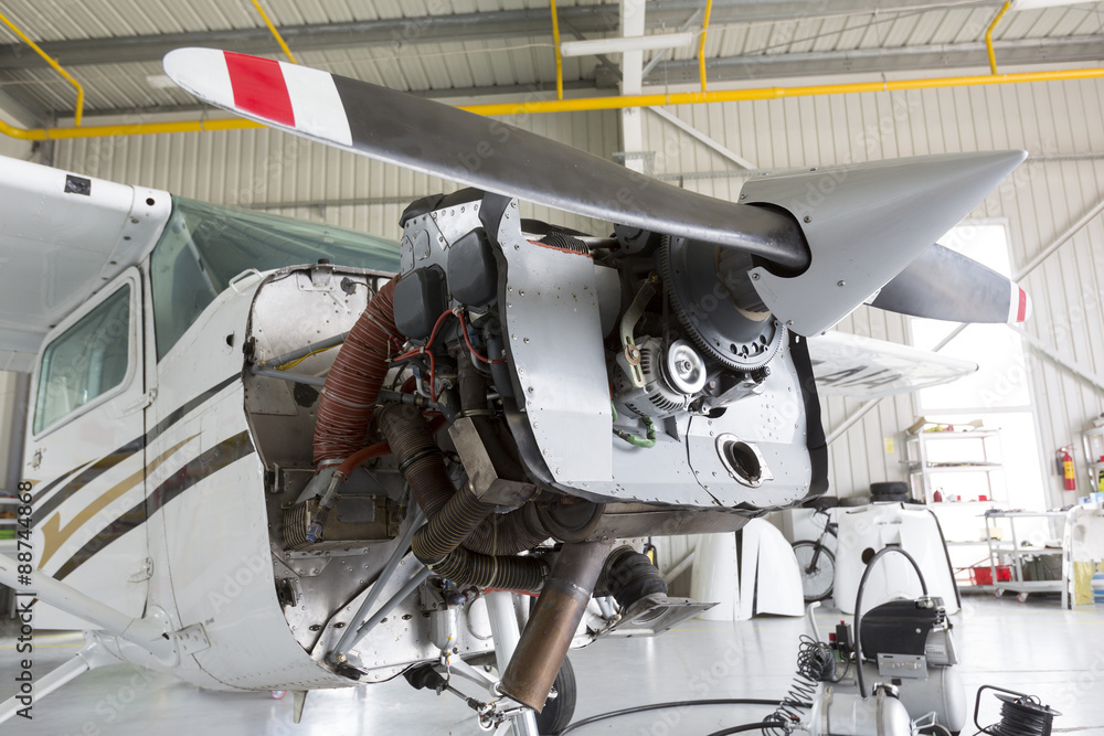 Repairing small propeller airplane Stock Photo | Adobe Stock