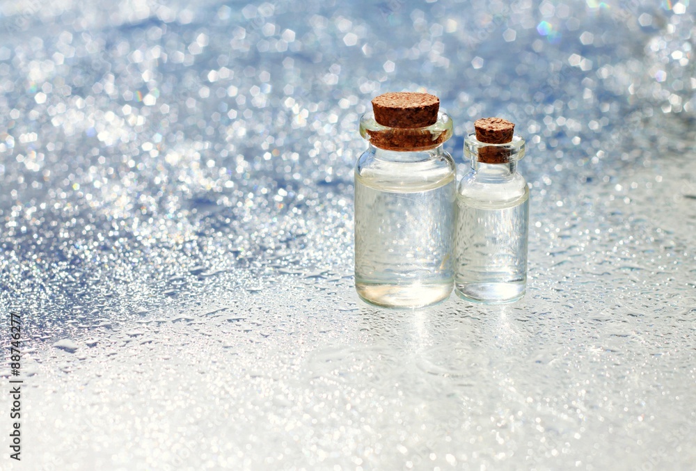 cosmetic glass bottles liquid product fresh icy sparkling magical ...