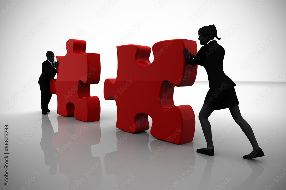 Executives placing jigsaw puzzle pieces in teamwork. A team of two ...