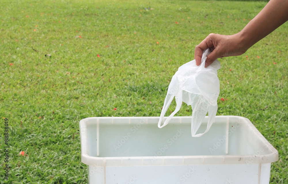Mosaic closeup of a woman throwing a crumpled piece of plastic bag in ...