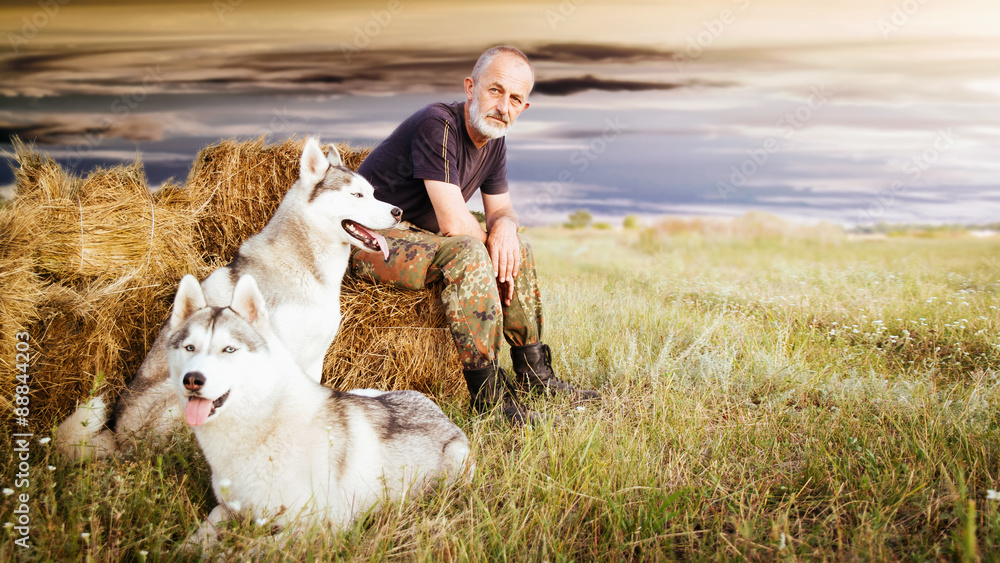 Farmer after a hard day's work. Old man with a beard sitting on a ...