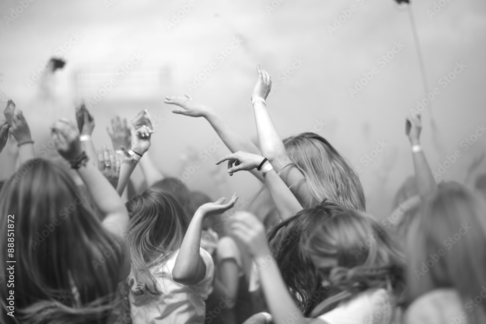 Raised hands of young people in a crowd Stock Photo | Adobe Stock