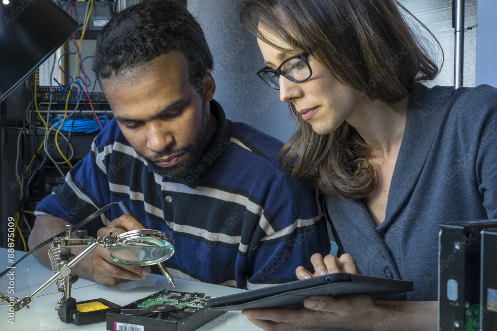 Male and female information technology workers Stock Photo | Adobe Stock
