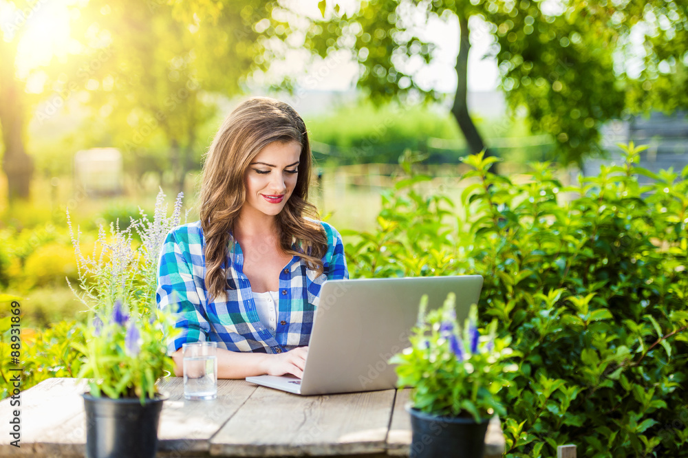 Beautiful young woman gardening Stock Photo | Adobe Stock
