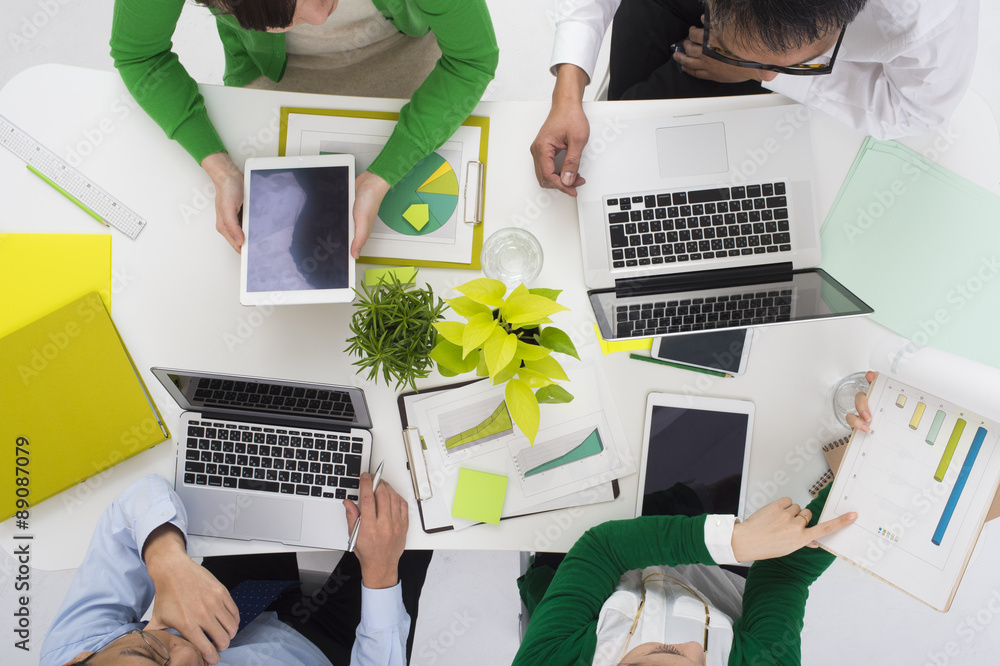 Four people have a meeting in the office, bird's-eye view shooting ...