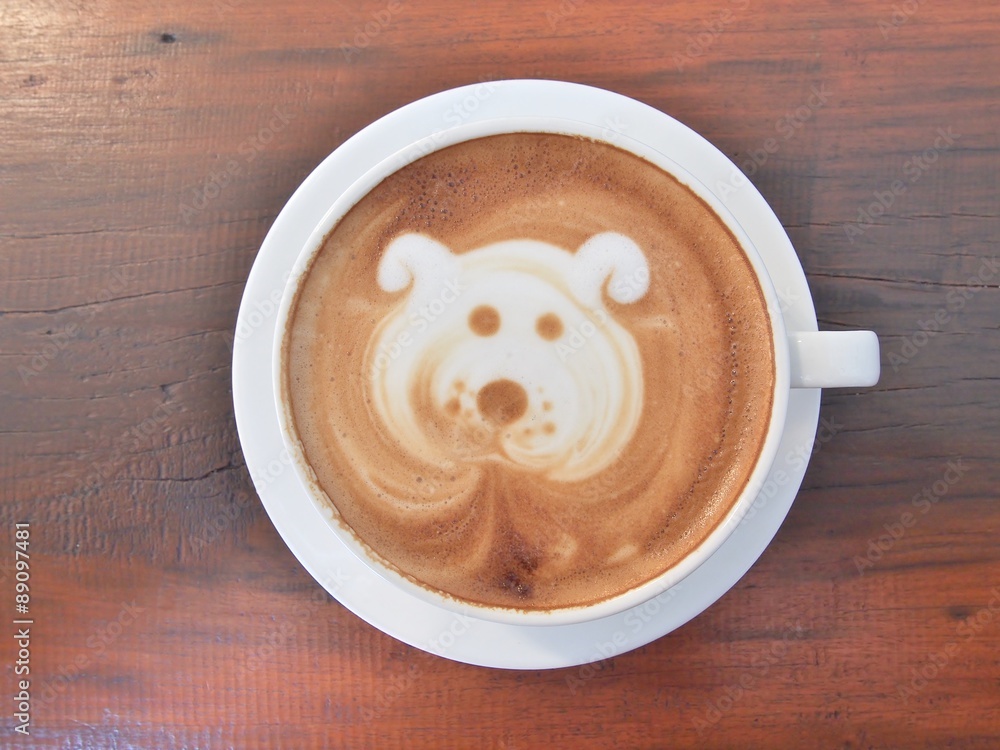 Latte Coffee art "Dog Face" on the wooden desk. Stock-Foto | Adobe Stock