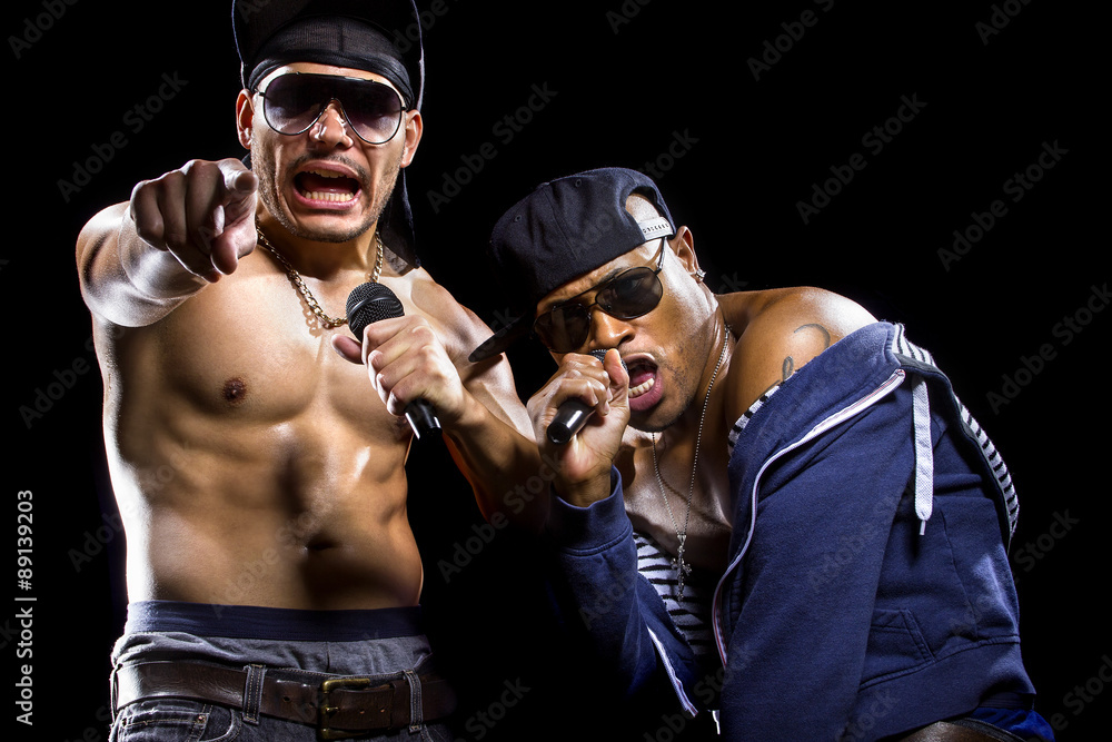 Rap concert with two muscular shirtless men with microphones Stock ...