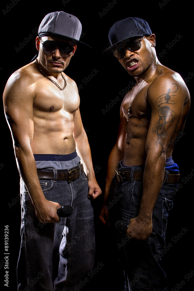 Rap concert with two muscular shirtless men with microphones Stock ...