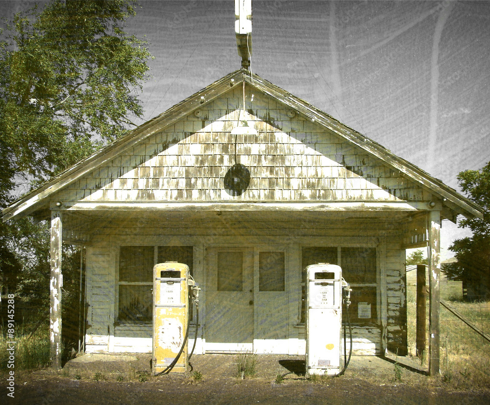 aged and worn vintage photo of old gas station and pumps Stock Photo ...
