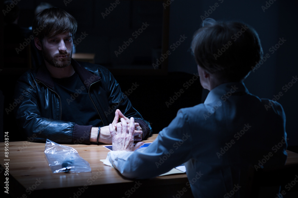 Policewoman interrogating young criminal Stock Photo | Adobe Stock